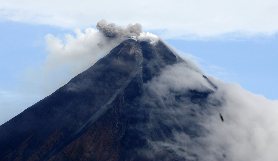 Mayon volcano in Philippines spews lava fountains & ash plumes as ...
