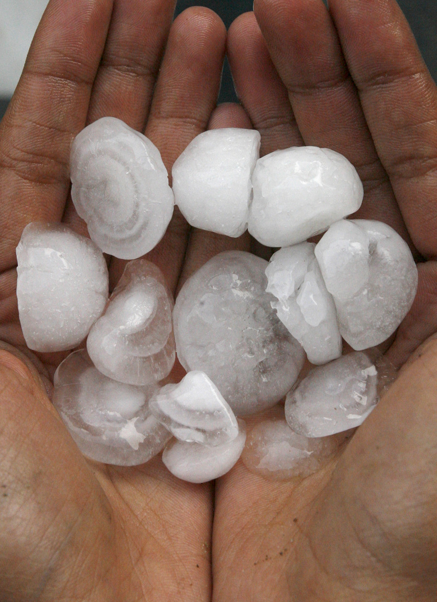 Mother battered by massive hailstones in heroic attempt to spare her ...