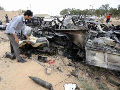 Finally at rest: Gaddafi’s rotting corpse buried — RT World News