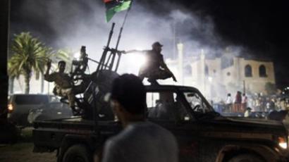 Finally at rest: Gaddafi’s rotting corpse buried — RT World News